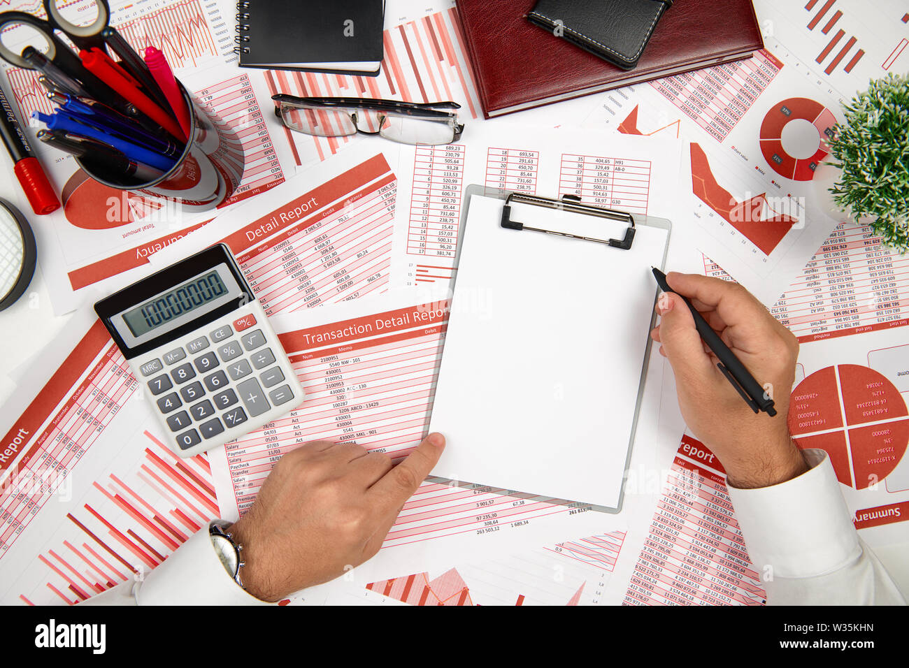 Business reports, data tables and charts - directly above view of ...