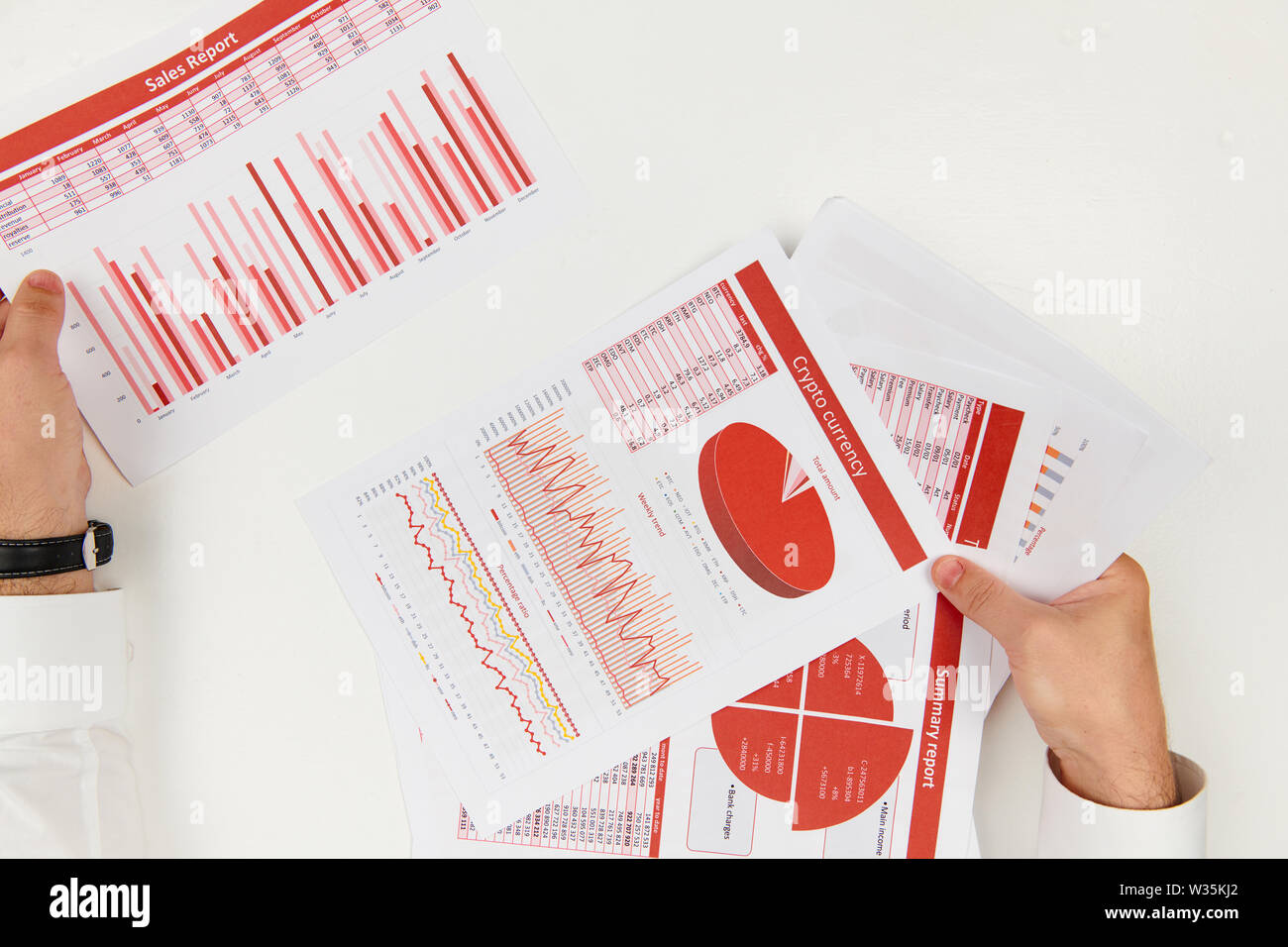 Business reports, data tables and charts - directly above view of ...