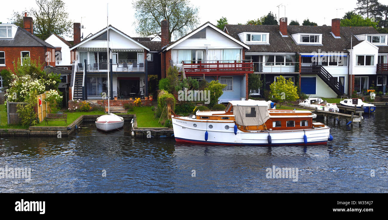 Waterside properties and old fashioned cruiser on the river Bure at ...