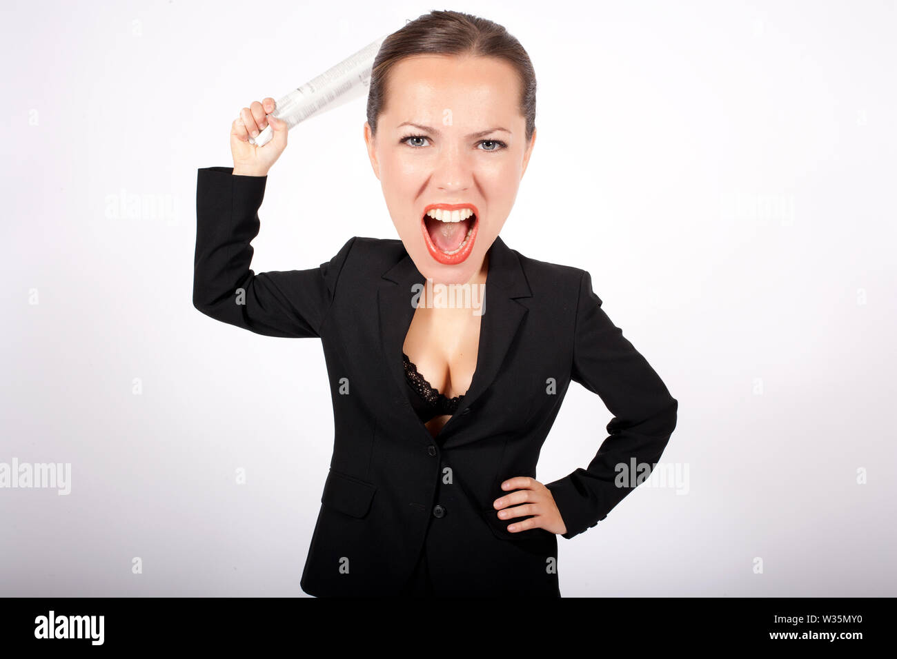angry woman in suit with big head holding a rolled up newspaper Stock ...