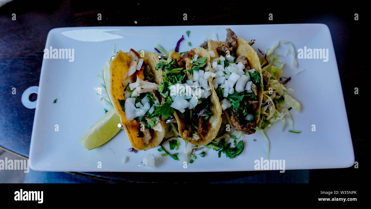 Ceramic, small blue handmade roses on a darker blue ceramic background ...