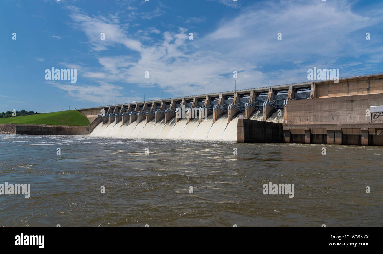 Water flowing through the open gates of a hydro electric power station ...
