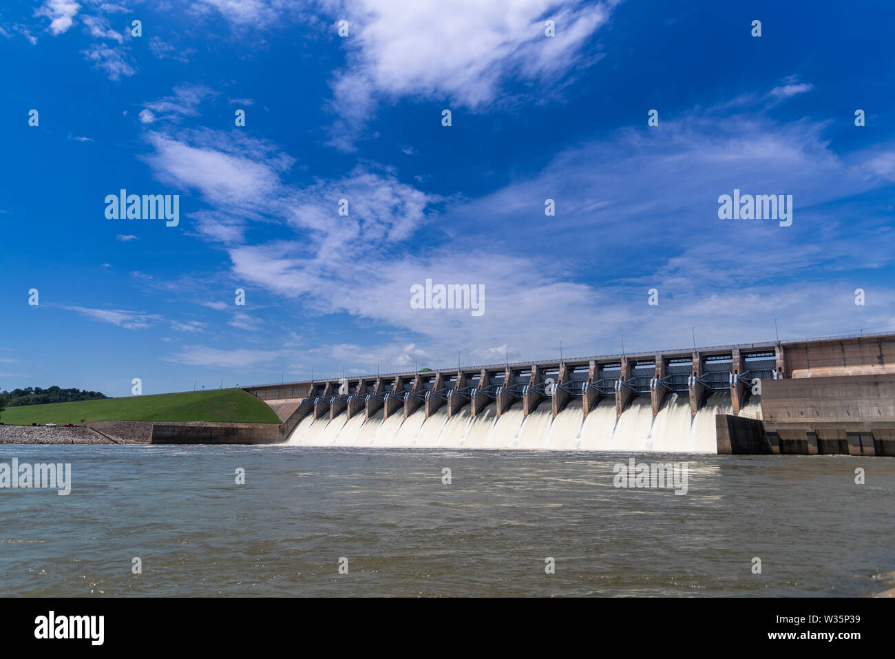 Water flowing through the open gates of a hydro electric power station ...
