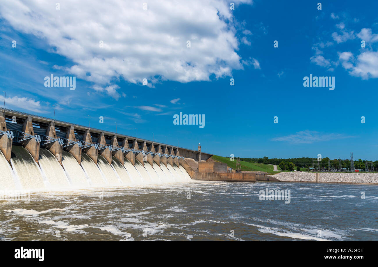 Water flowing through the open gates of a hydro electric power station ...