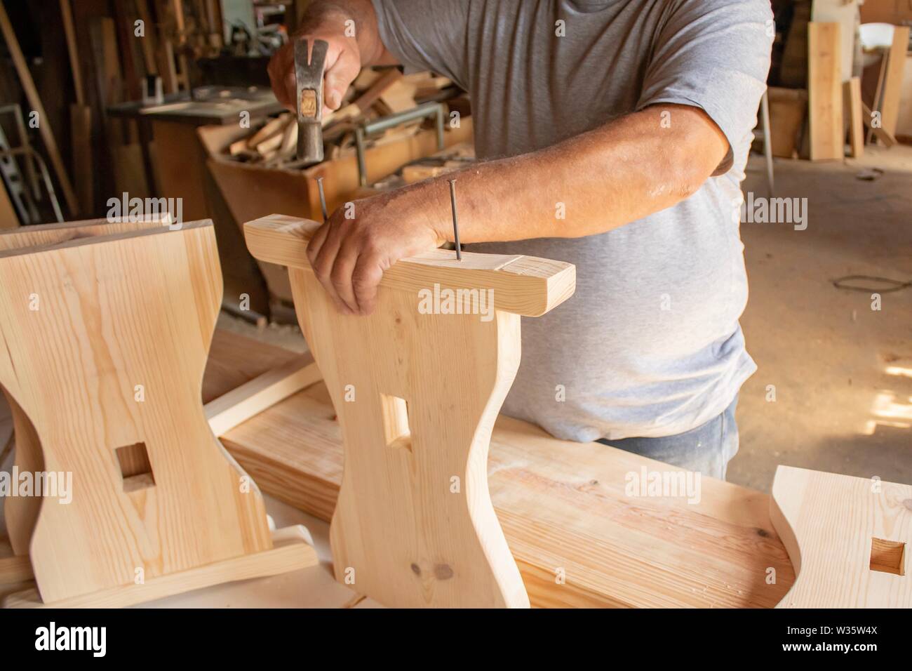 Carpenter working. Hands doing woodwork with natural light. Woodworking ...