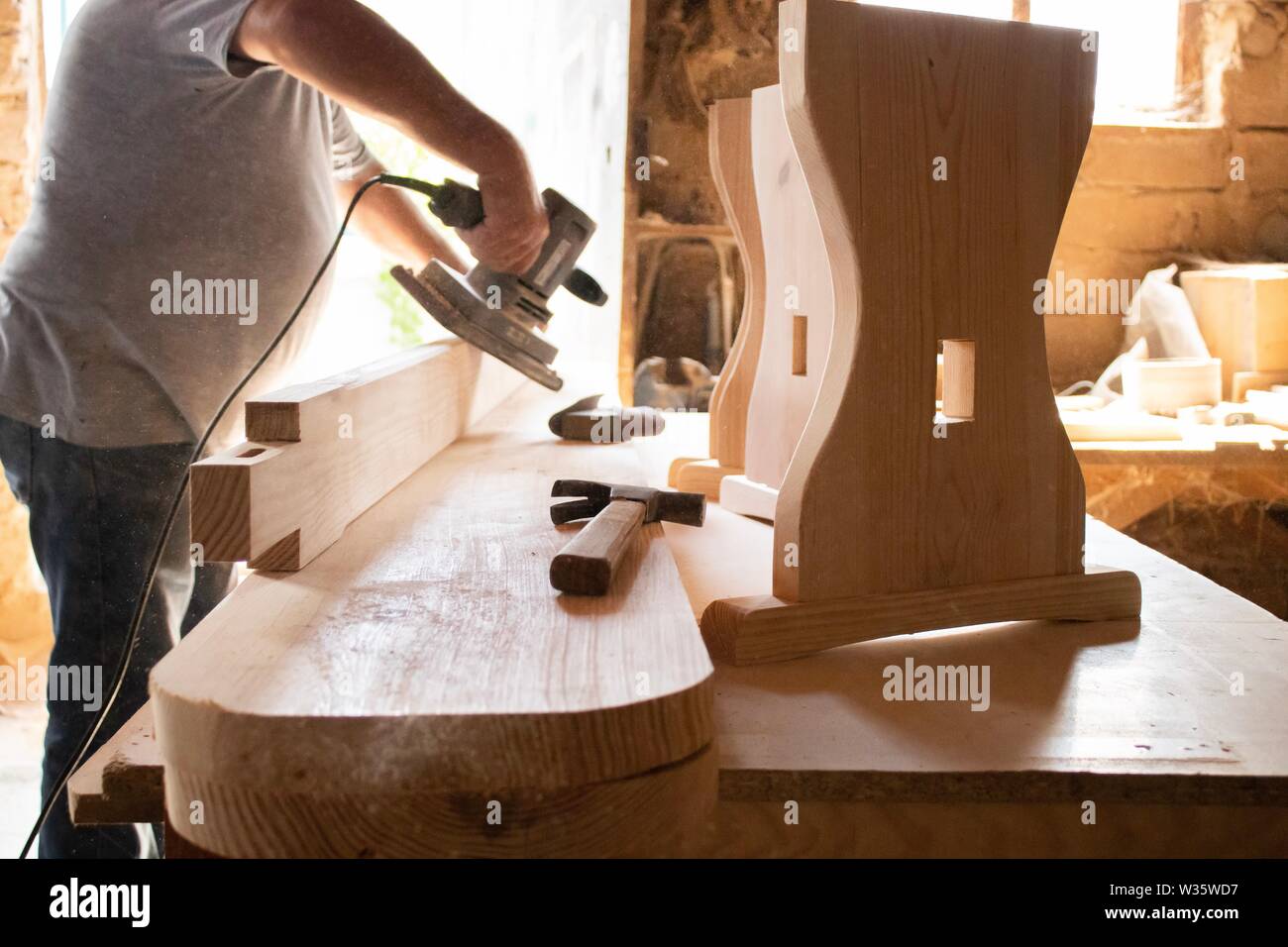 Carpenter working. Hands doing woodwork with natural light. Woodworking ...