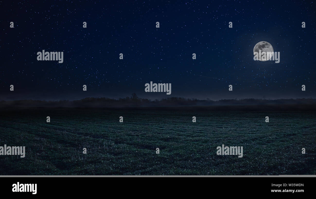 Full moon night landscape with fog in the background Stock Photo - Alamy