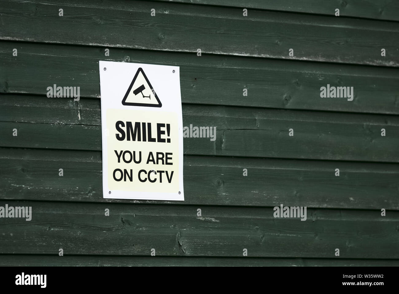 Smile you are on CCTV sign Stock Photo - Alamy