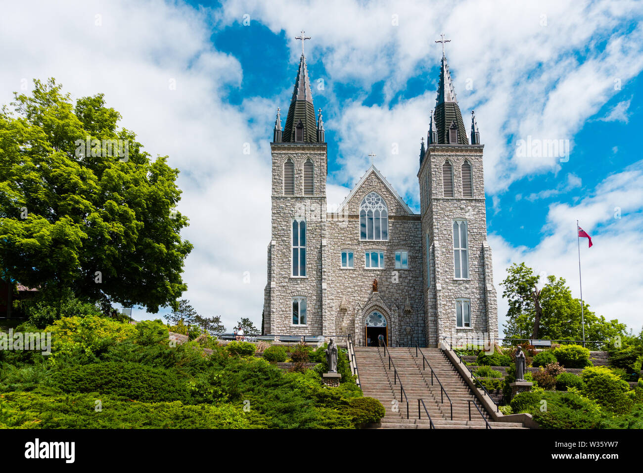 A beautiful Catholic cathedral stands on a hill leading to a long ...