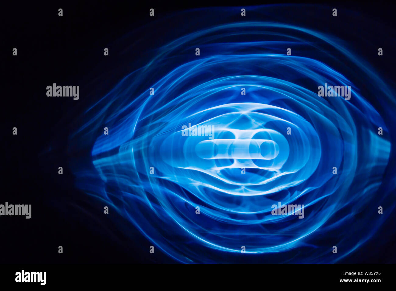 Sound waves in the dark. Blue color Stock Photo - Alamy
