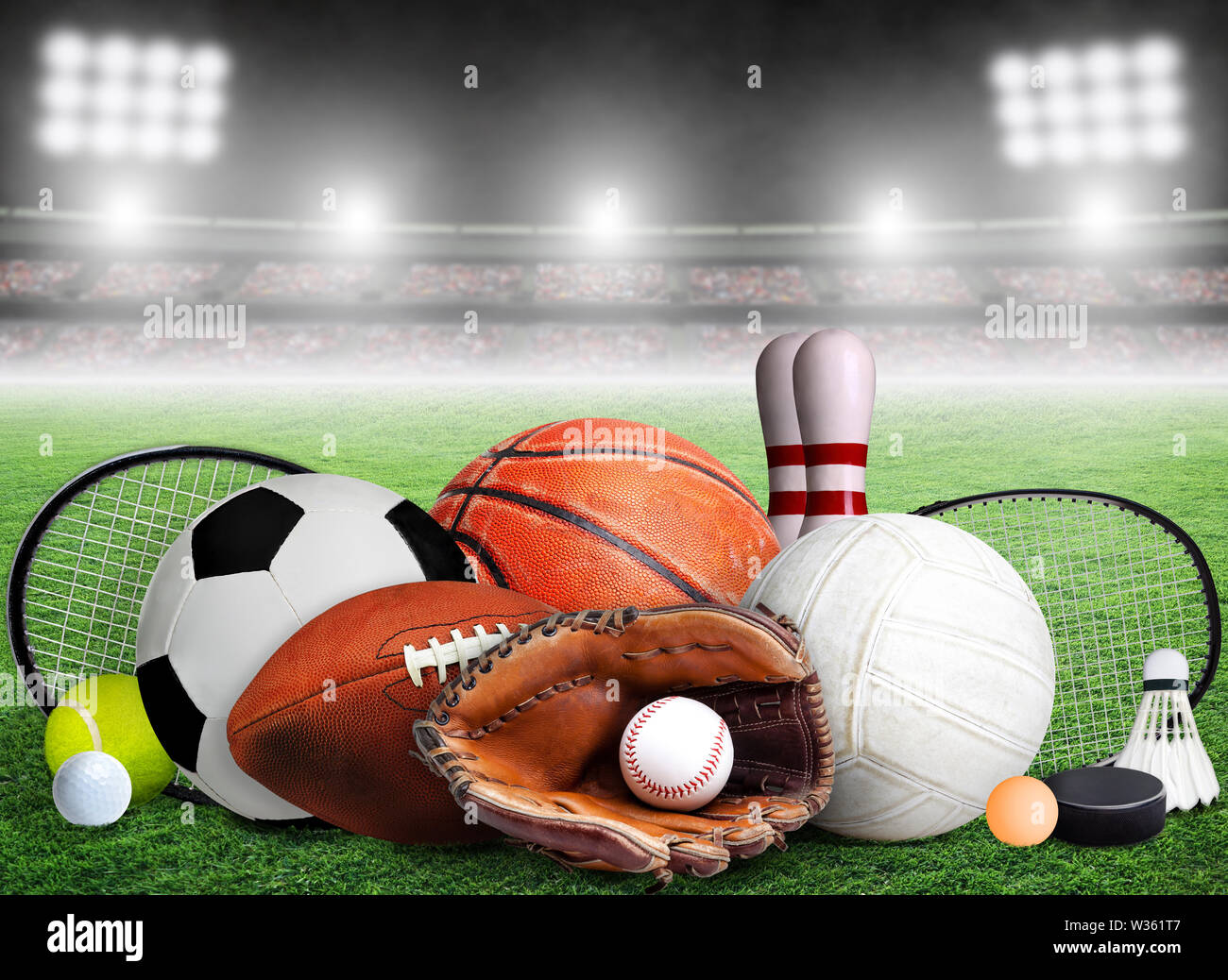 Sports equipment, rackets and balls in stadium background with copy ...