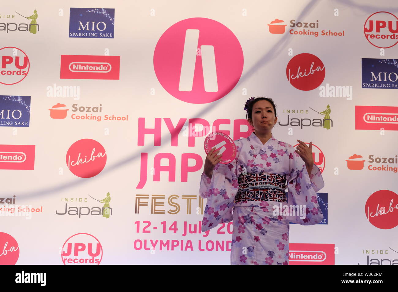 A host on stage at the Hyperjapan event in London's Olympia. It is a bi ...