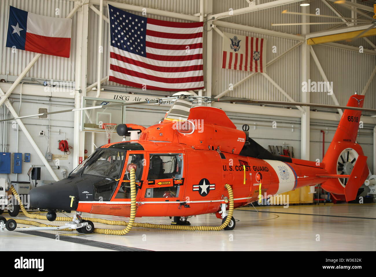 An MH-65 Dolphin helicopter sits at the ready to respond to Tropical ...