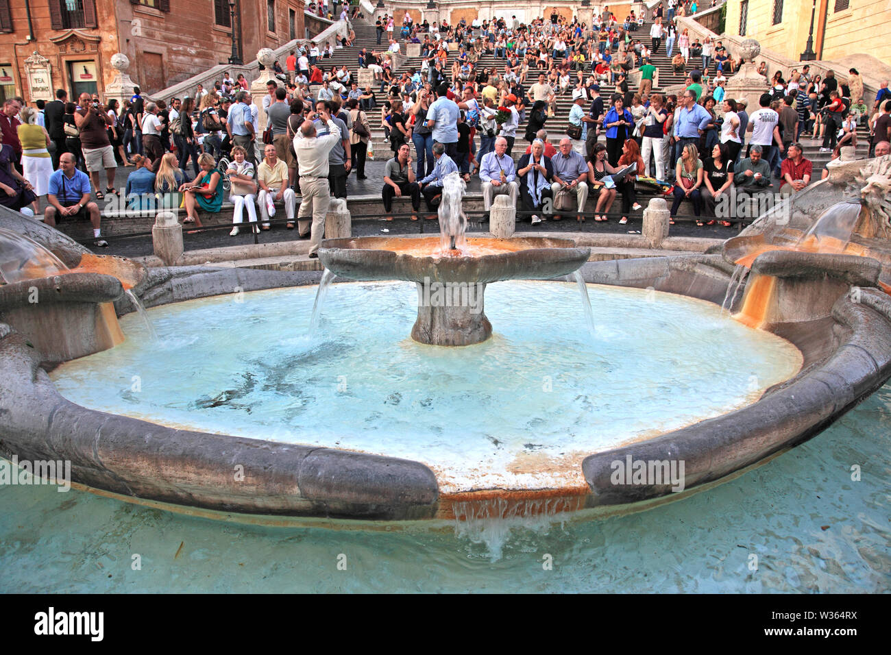 The iconic tourist attractions the Barcaccia (the sinking boat) and ...