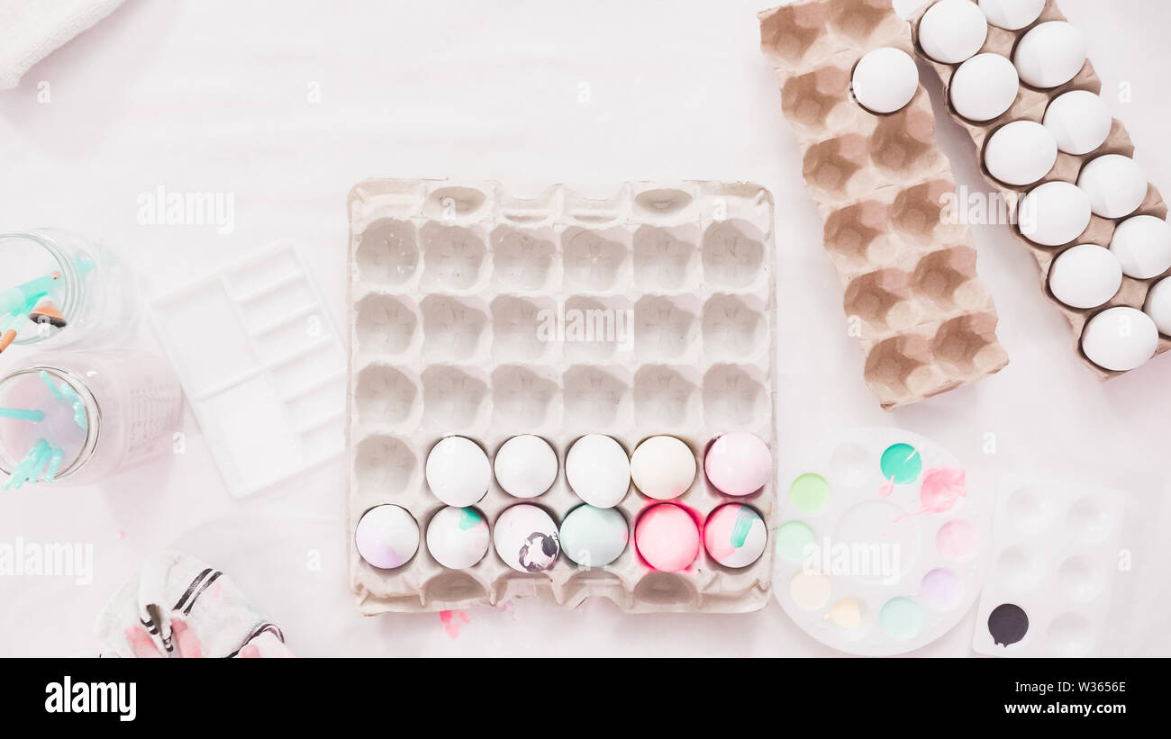 Flat lay. Painting craft Easter eggs with acrilic paint Stock Photo - Alamy