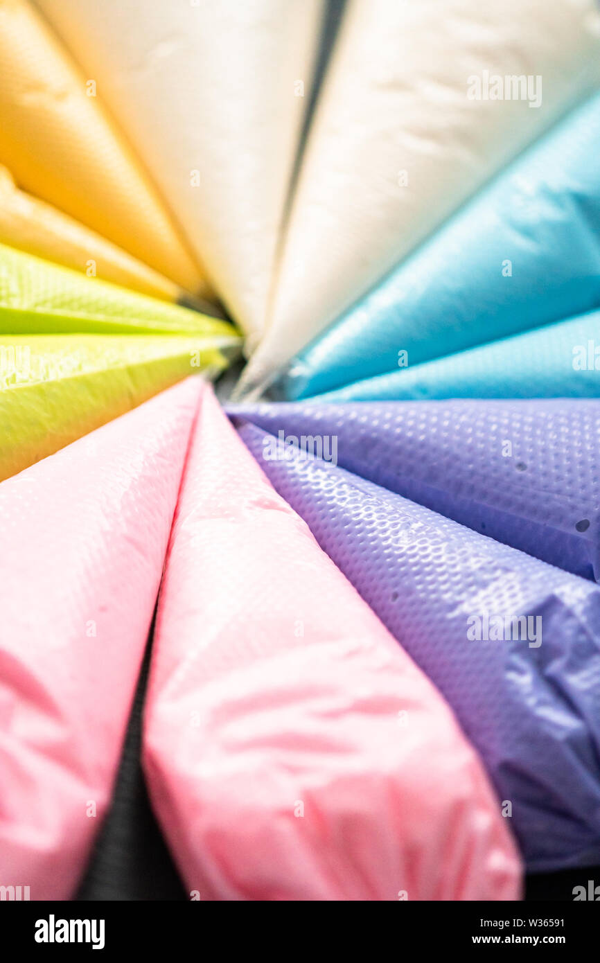 Variety of colors of royal icing in plastic piping bags Stock Photo - Alamy