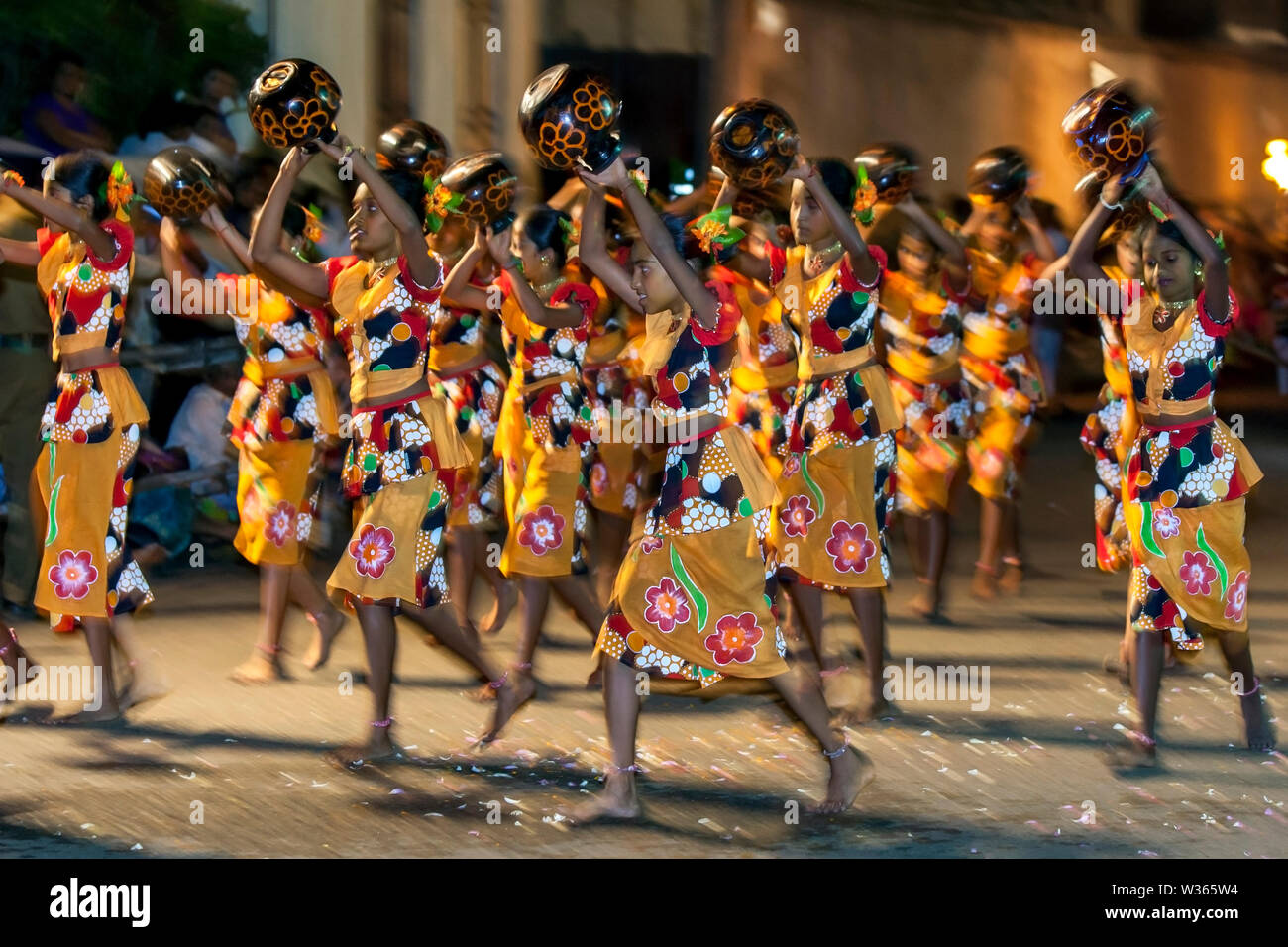 Procession of the Paththini Devala dancers perform to honour the ...