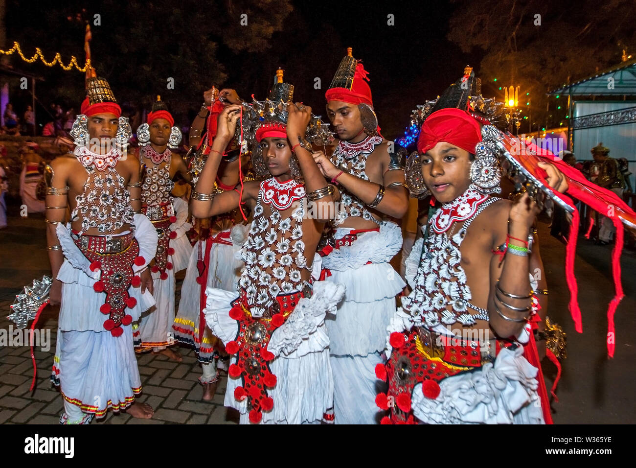 Up Country Dancers prepare their costumes prior to the Esala Perahera ...
