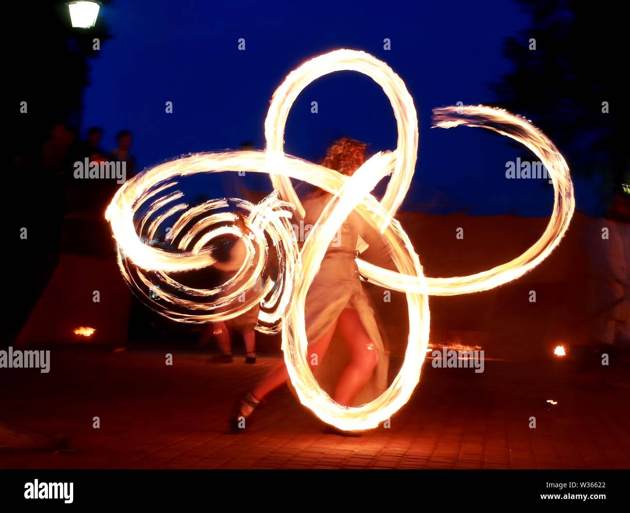 Vitebsk, Belarus. 12th July, 2019. A performer displays fire juggling ...