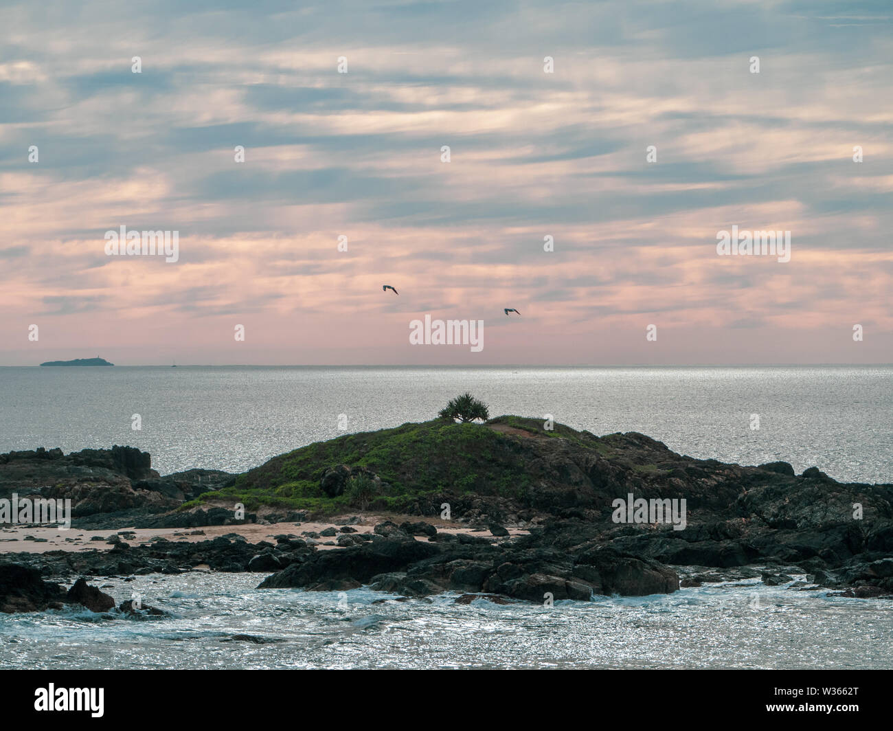 looking out to the horizon, sky of pastel pink and blue, seascape ...
