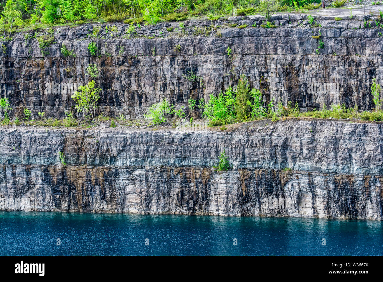 Close up view of Marmora mine showing rocky wall with beautiful blue ...