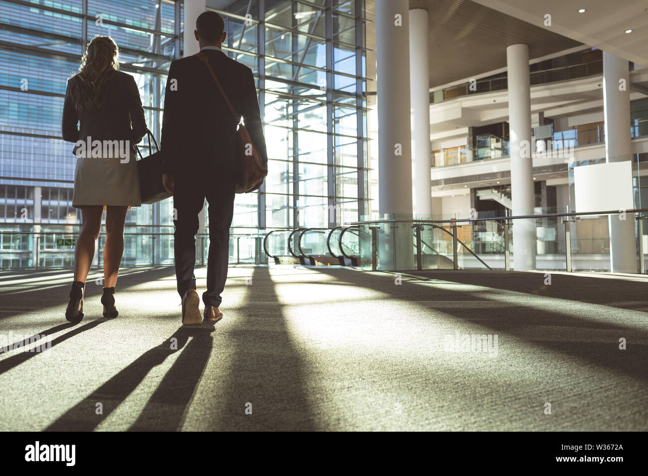 Business people walling together in a modern office building Stock ...
