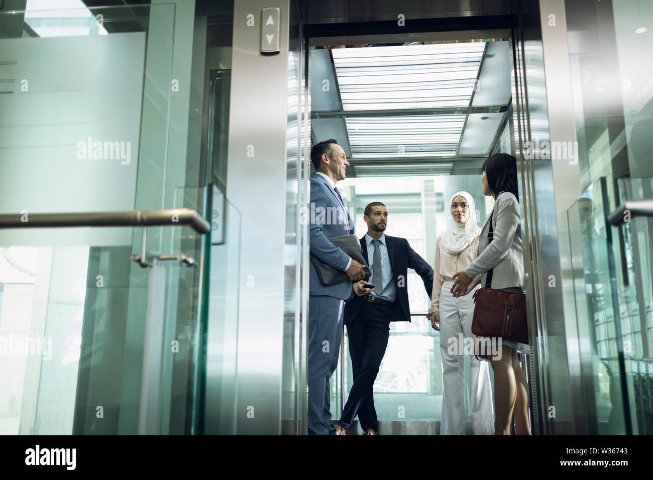 Man and woman office lift hi-res stock photography and images - Alamy