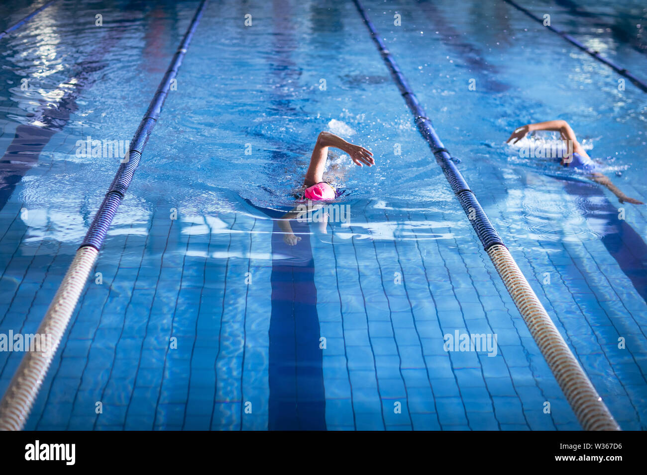 Swimmers in a pool Stock Photo - Alamy