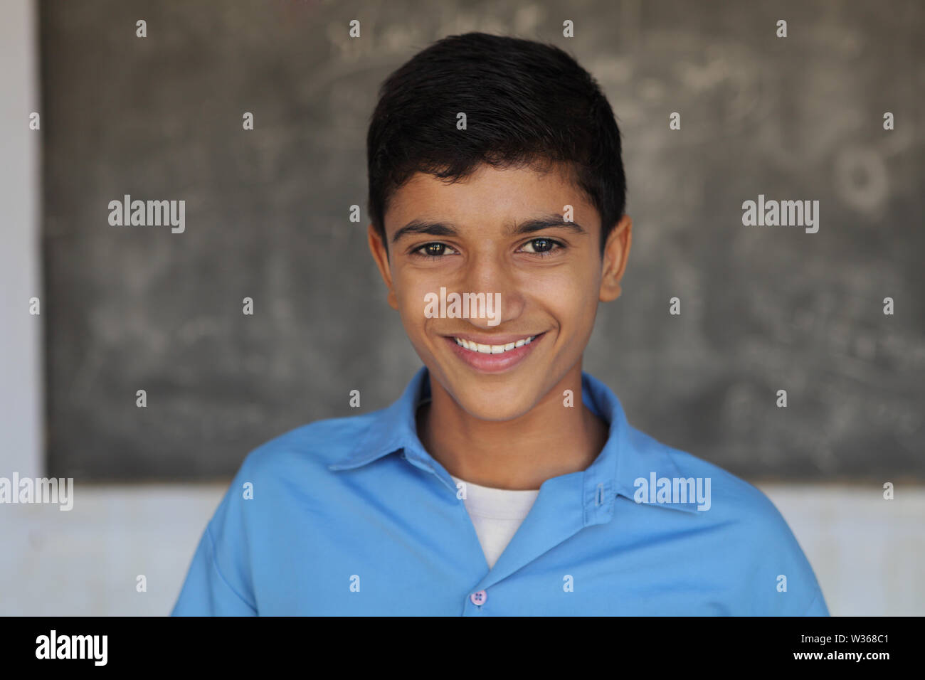 Portrait of a schoolboy smiling Stock Photo - Alamy