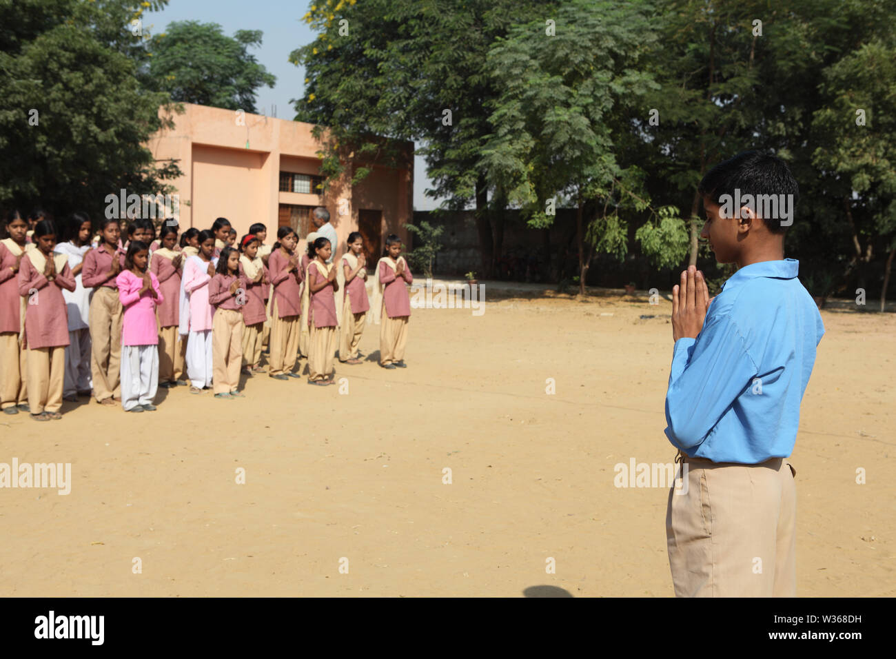 School children praying during assembly at school Stock Photo - Alamy