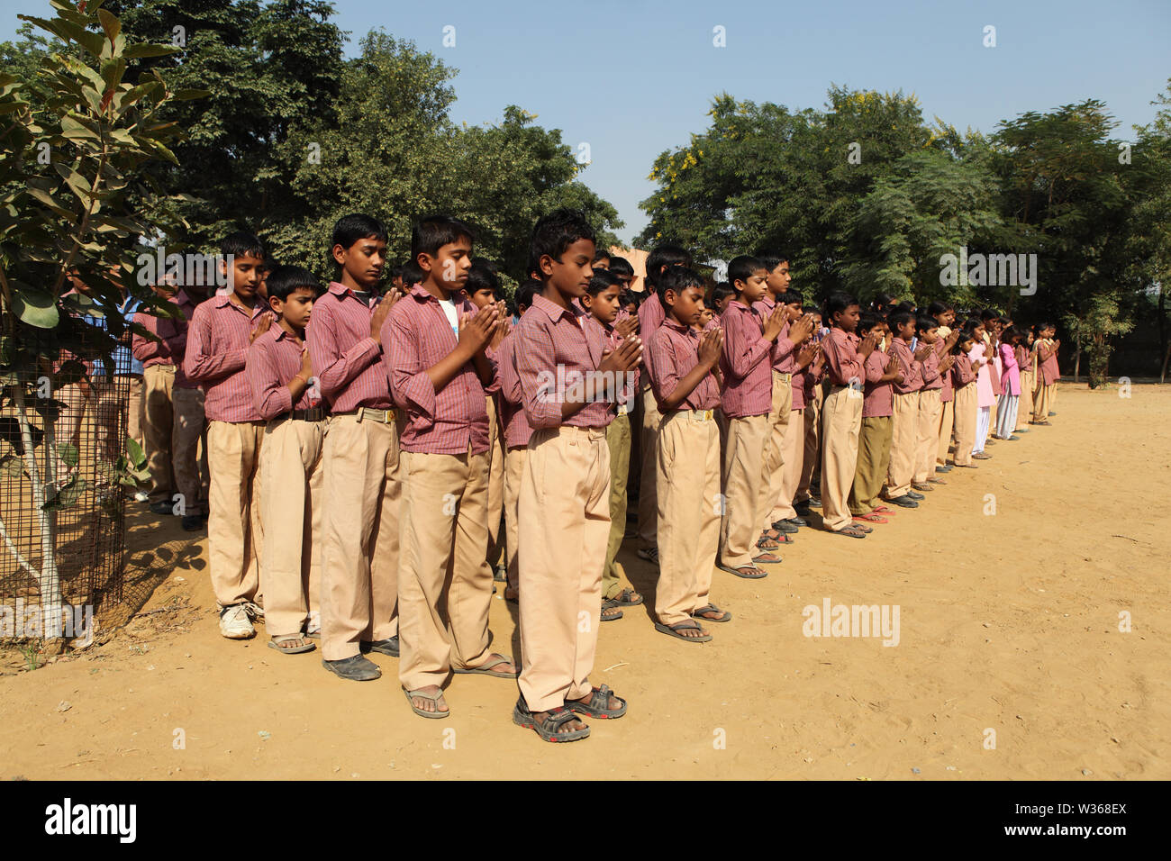 School children praying during assembly at school Stock Photo - Alamy