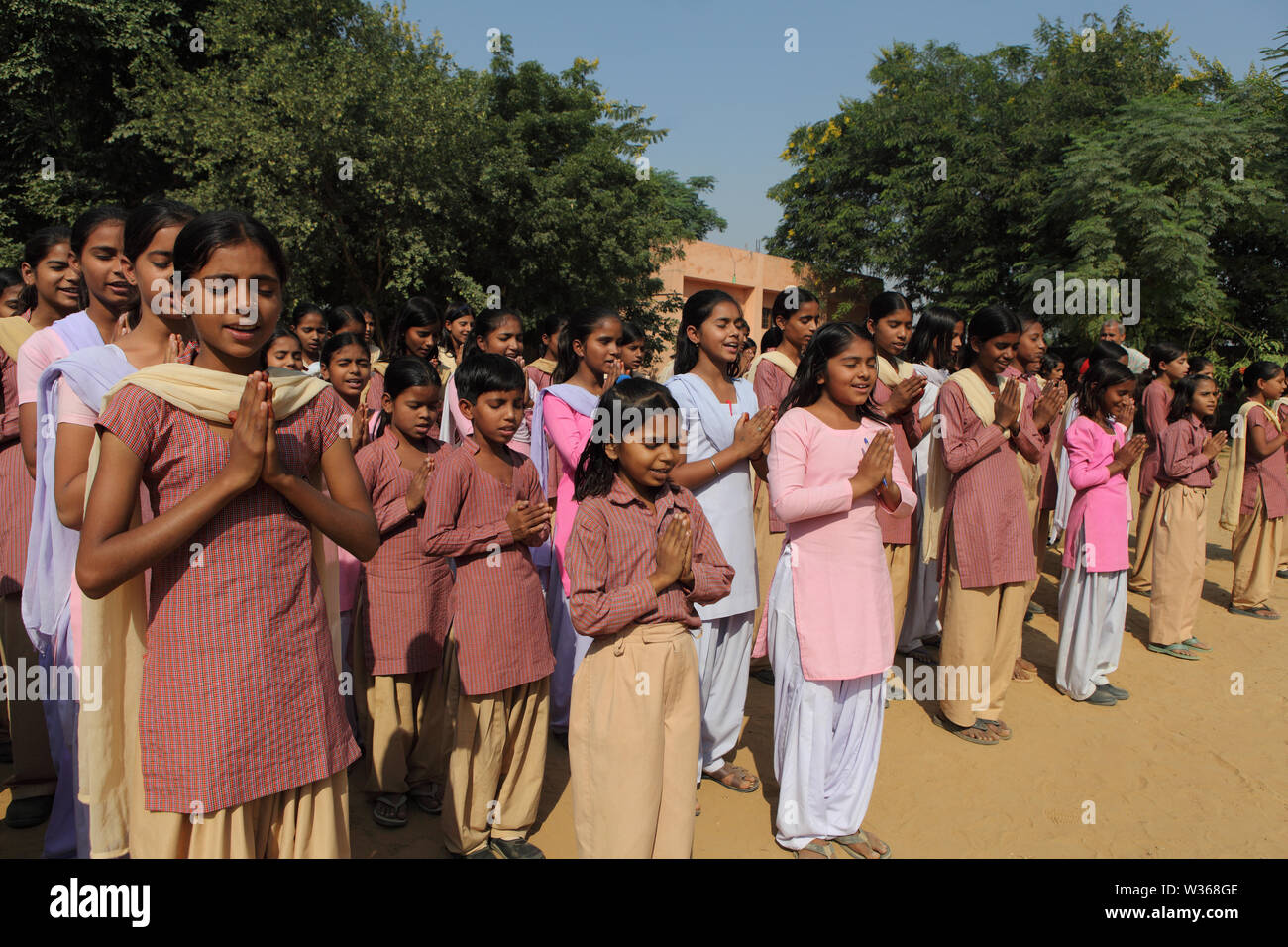 School children praying during assembly at school Stock Photo - Alamy