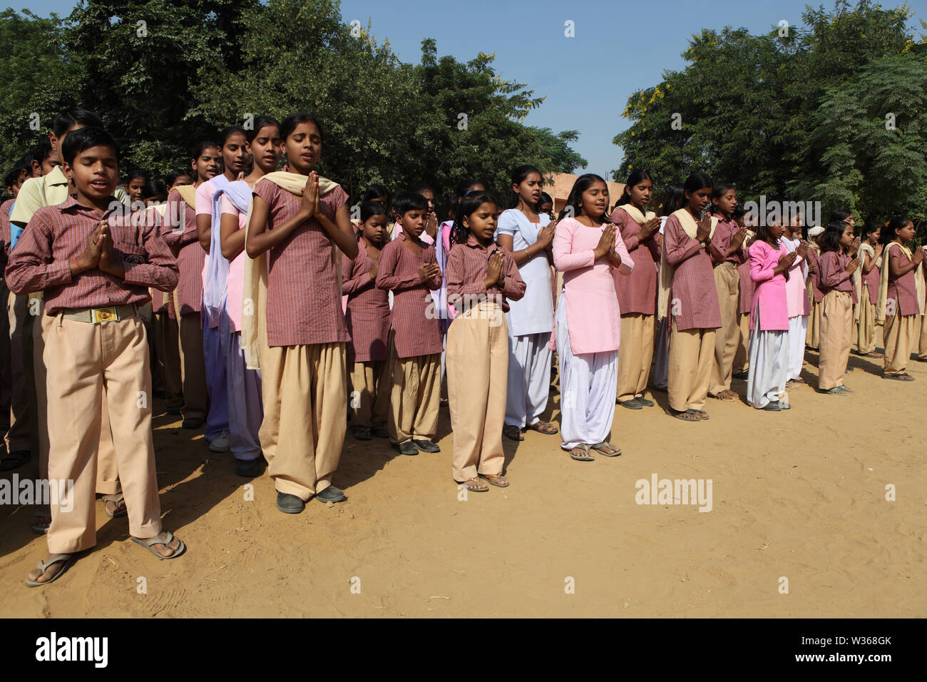 School children praying during assembly at school Stock Photo - Alamy