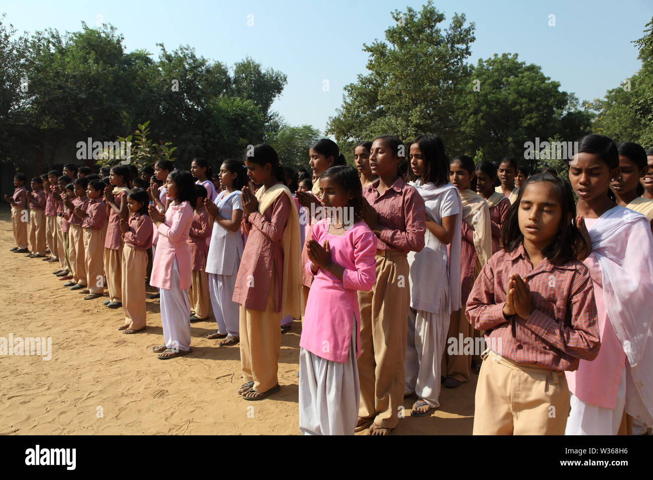 School children praying during assembly at school Stock Photo - Alamy