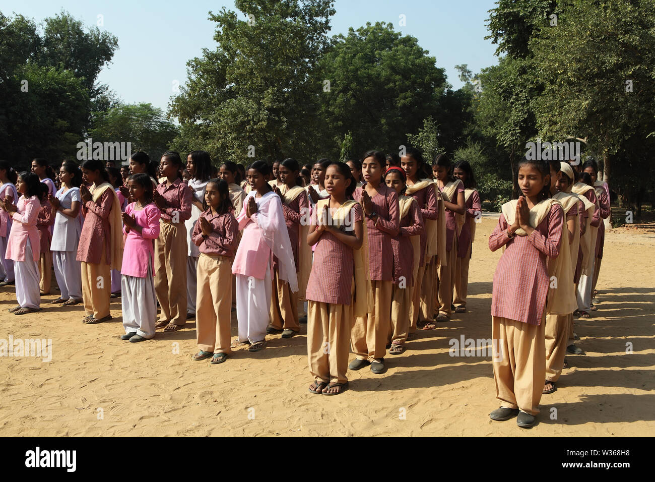 School children praying during assembly at school Stock Photo - Alamy