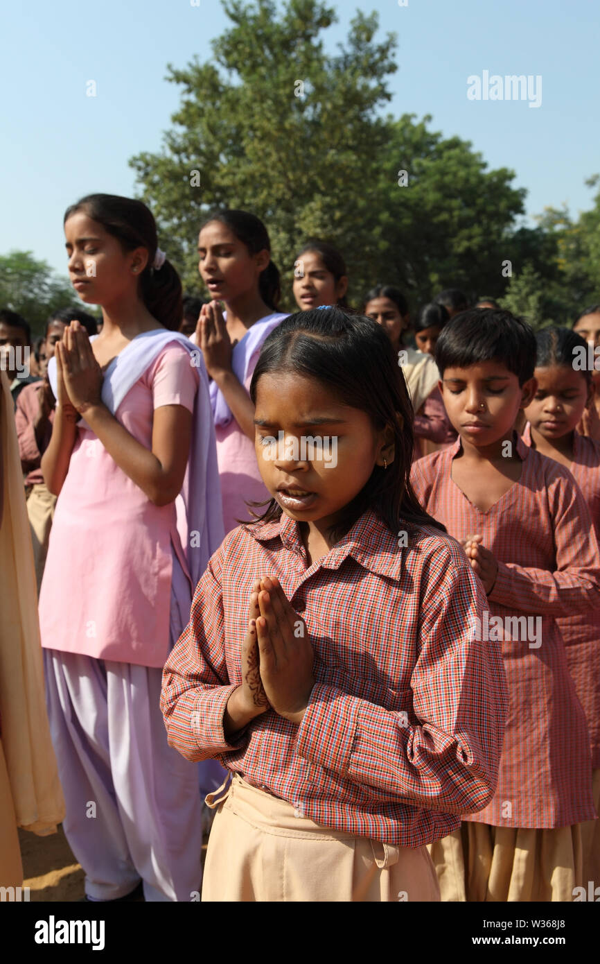 School children praying during assembly at school Stock Photo - Alamy