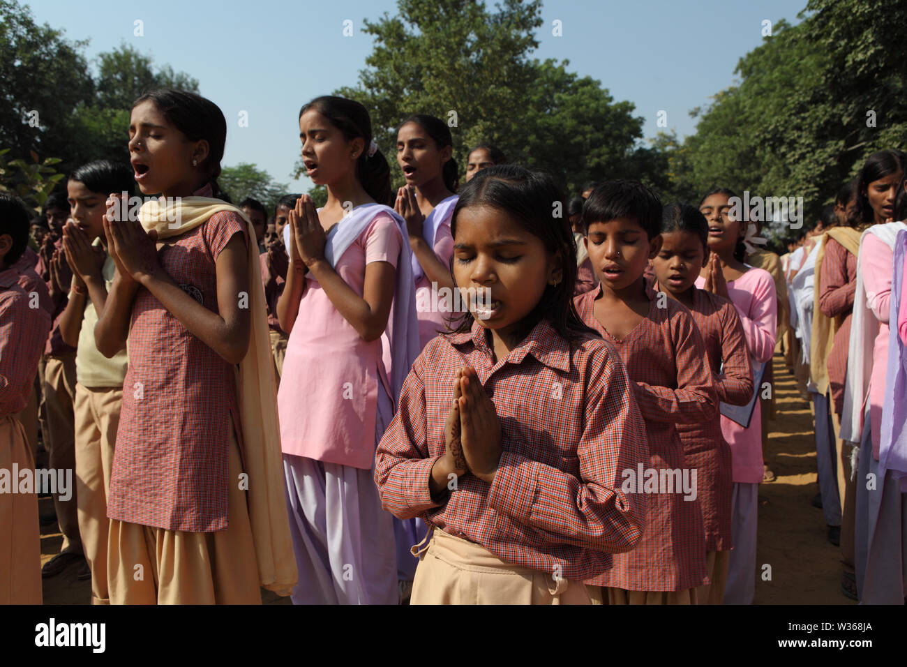 School children praying during assembly at school Stock Photo - Alamy