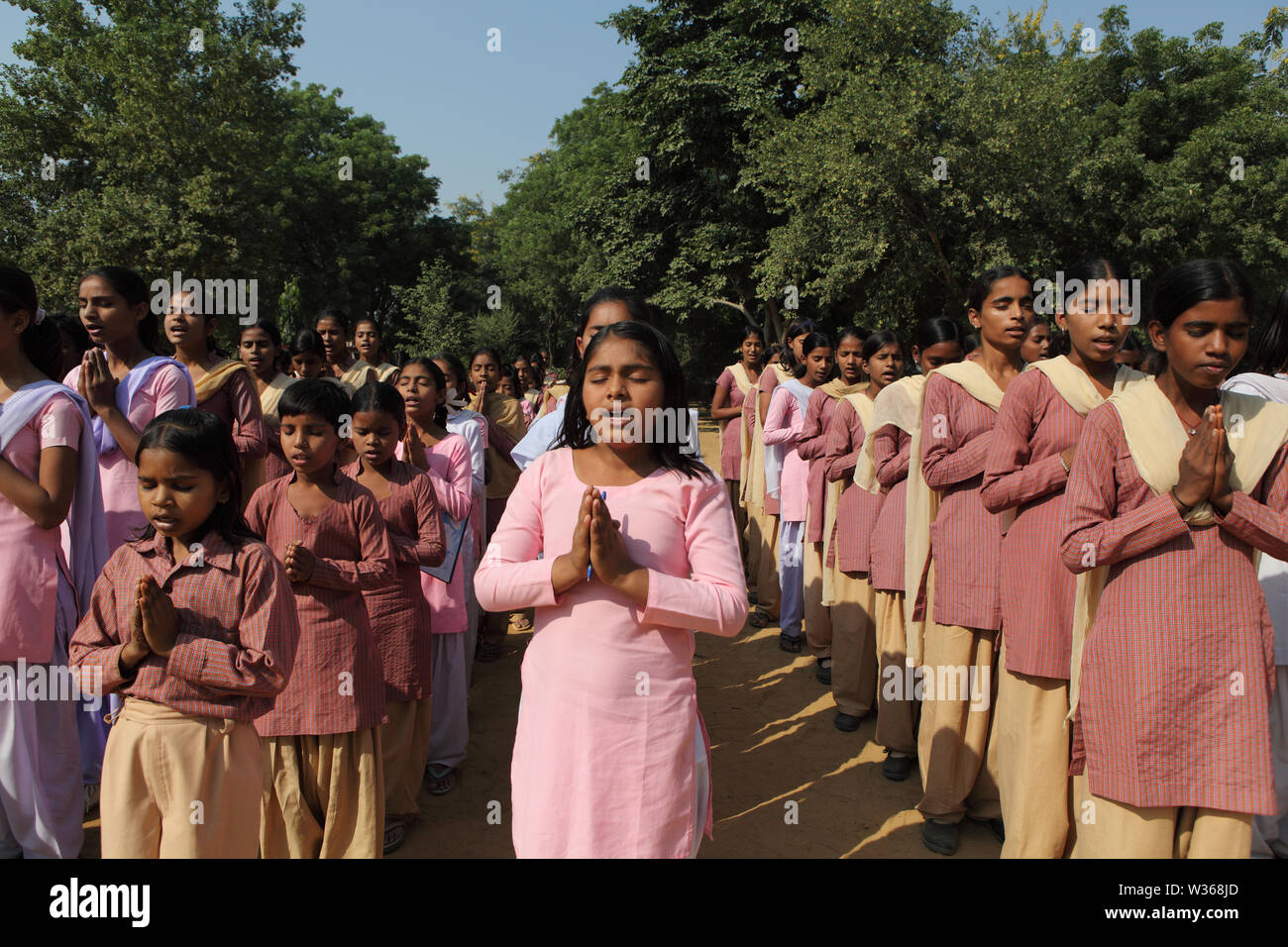 School children praying during assembly at school Stock Photo - Alamy