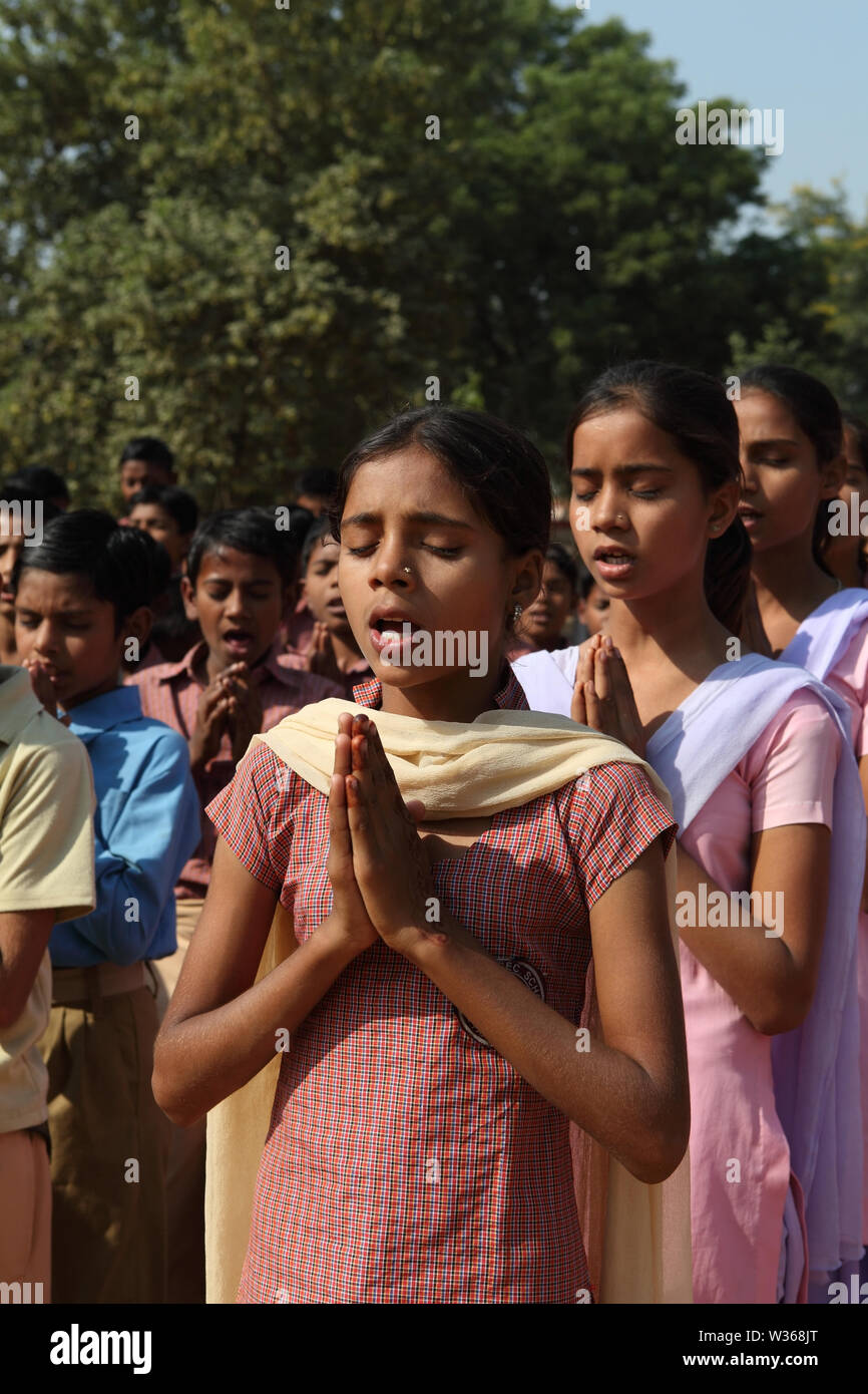 School children praying during assembly at school Stock Photo - Alamy