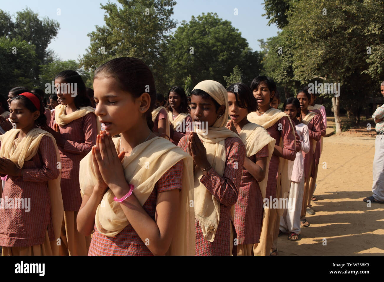 School children praying during assembly at school Stock Photo - Alamy