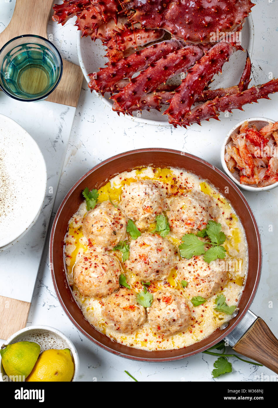 CRABMEATBALLS crab meatballs in white creamy sauce in red pan, whole ...