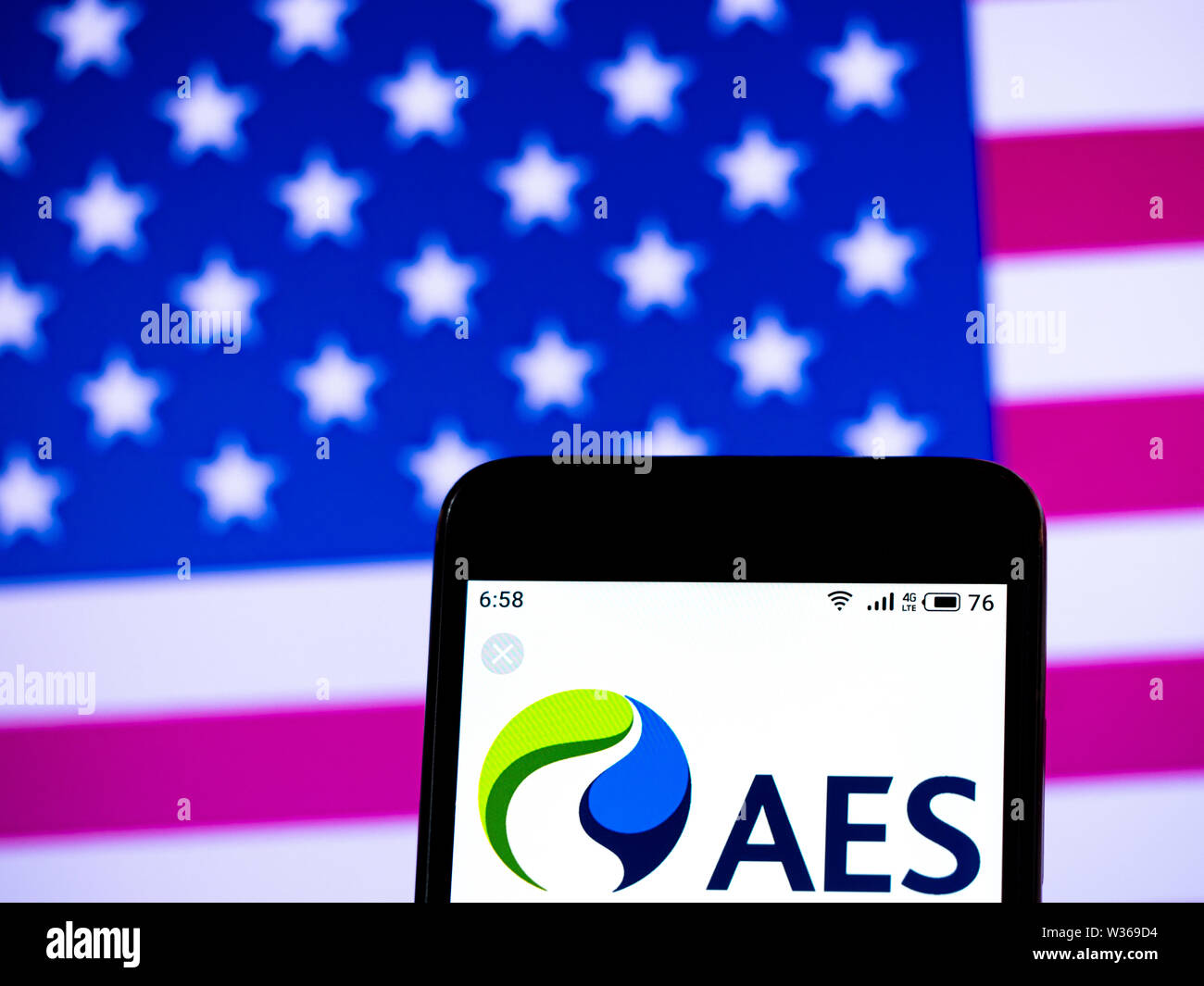 In this photo illustration the AES Corp logo is seen displayed on a ...