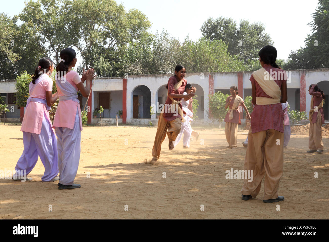 Schoolgirls playing in school Stock Photo - Alamy