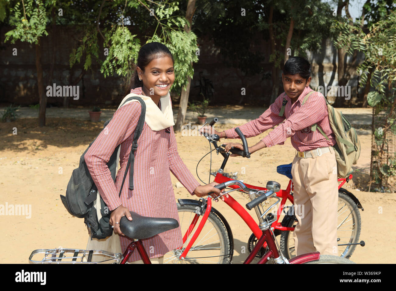 School children standing in school with bicycles Stock Photo - Alamy