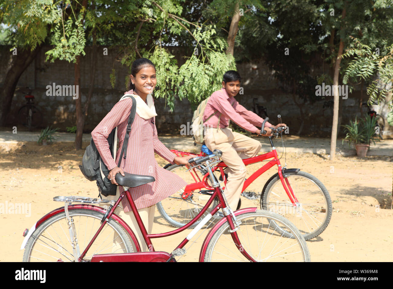 School children standing in school with bicycles Stock Photo - Alamy