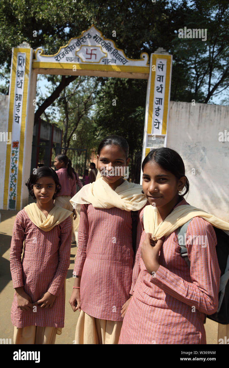Schoolgirls standing in front of a school gate Stock Photo - Alamy