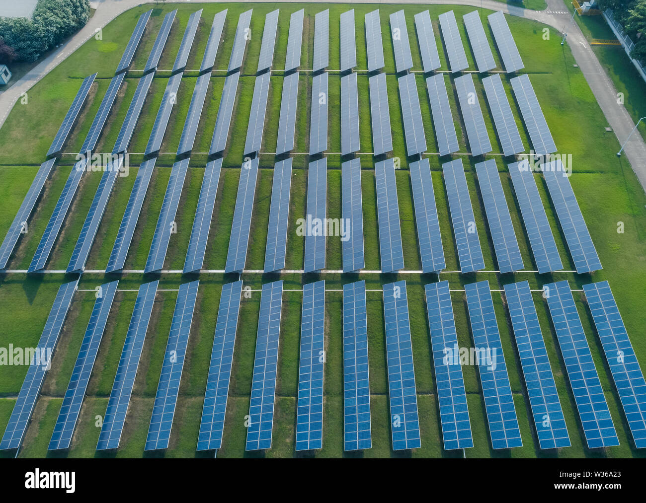 Aerial view of Solar Panels Farm with sunlight. Drone flight over solar ...