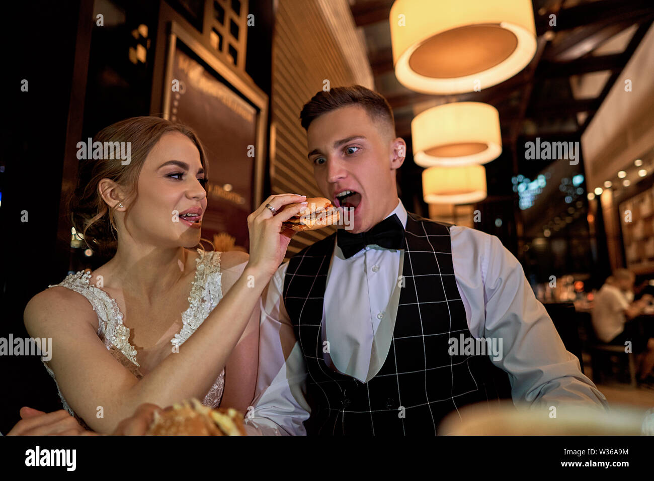 Man eating hamburger drinking beer hi-res stock photography and images - Alamy