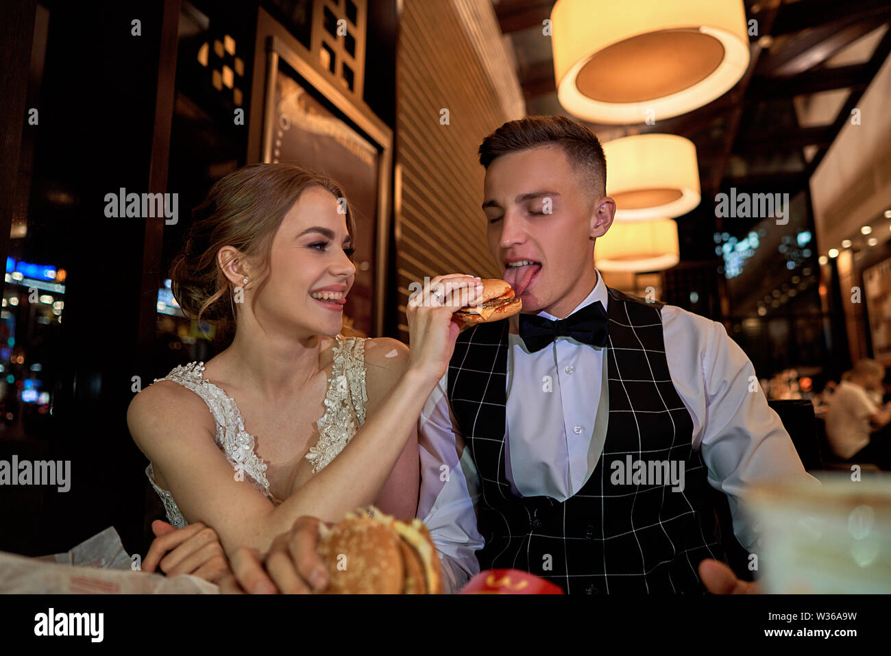 Man eating hamburger drinking beer hi-res stock photography and images ...