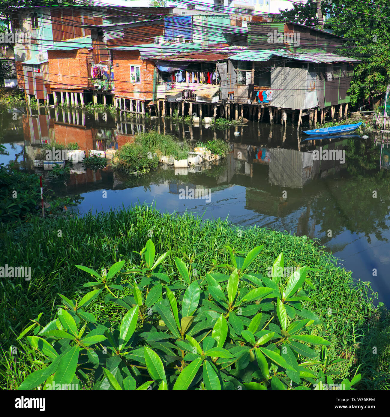 Group of temporary house and unsafe life on water of canal, polluted ...